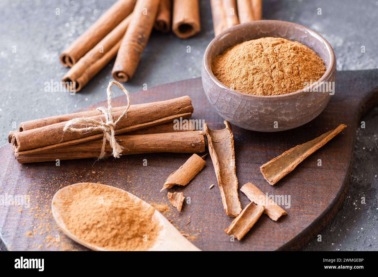 Cinnamon sticks and cinnamon powder on rustic background, healthy spice ...