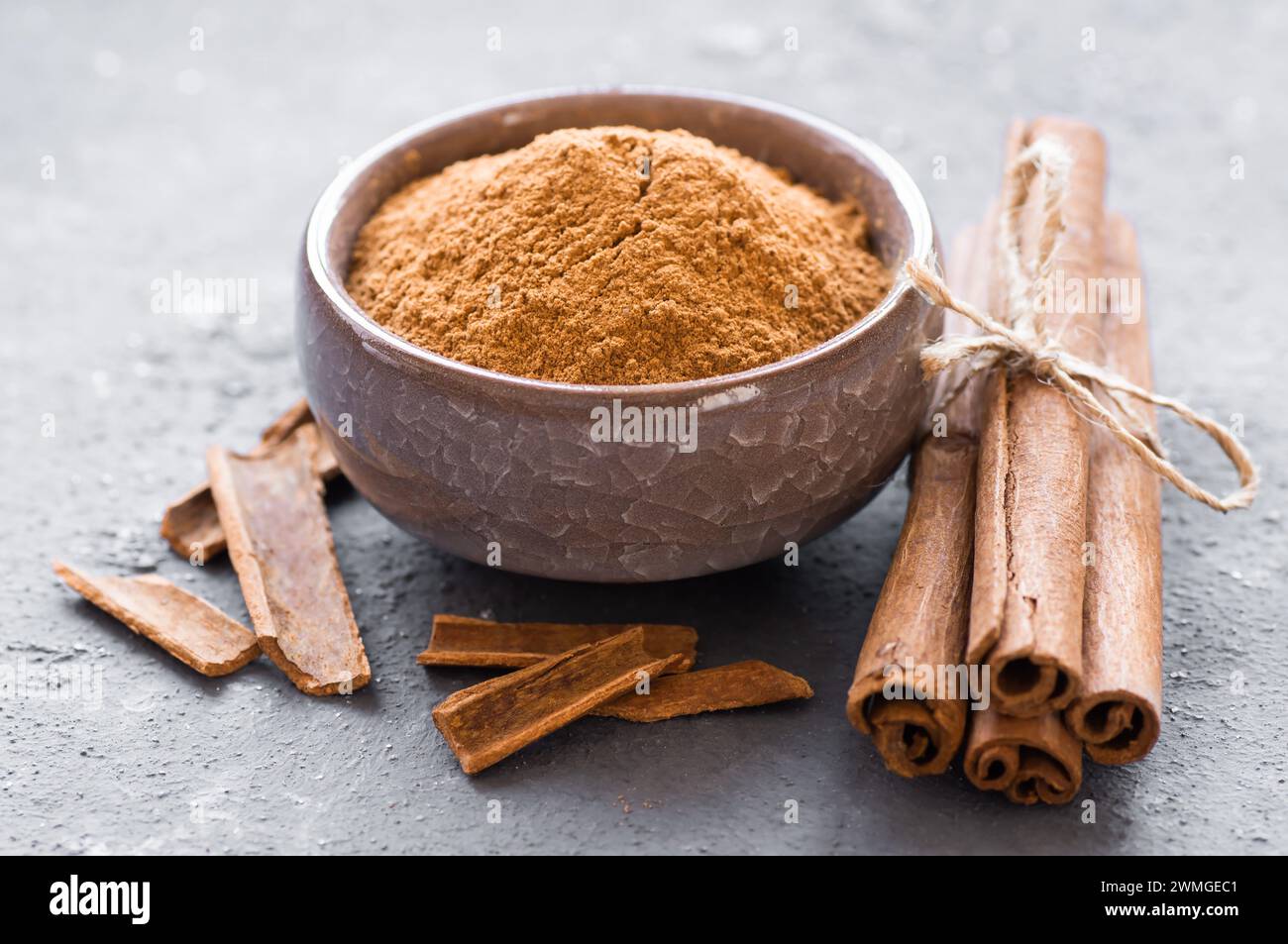 Cinnamon sticks and cinnamon powder on rustic background, healthy spice ...