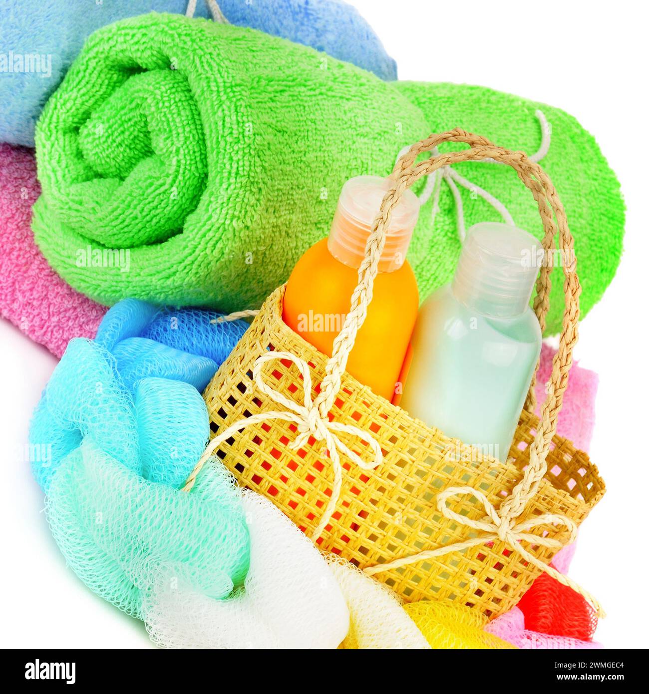 Cotton towels, cosmetic soap, sponge and shampoo isolated on white ...