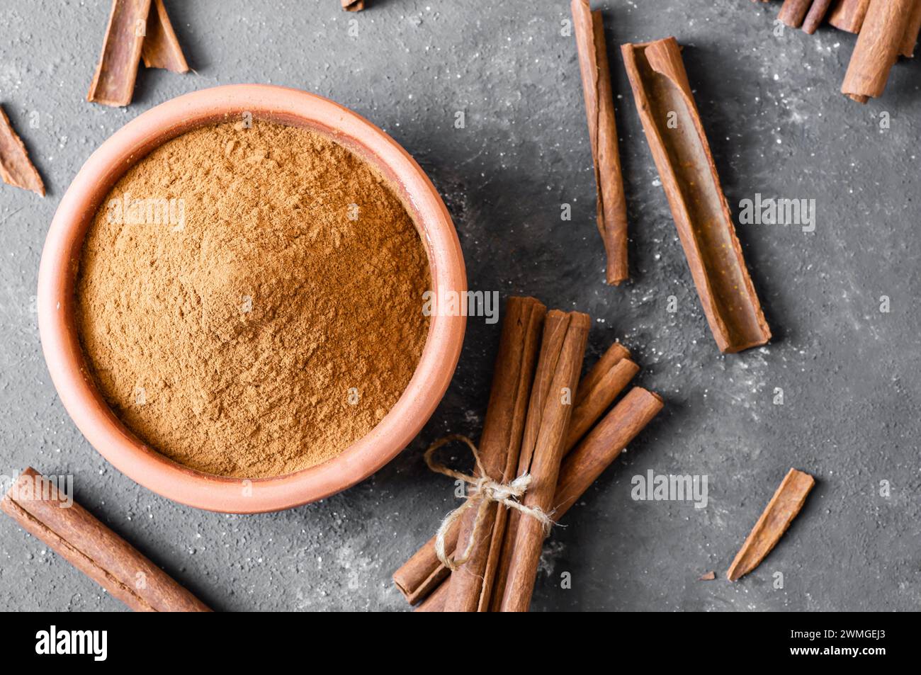 Cinnamon sticks and cinnamon powder on rustic background, healthy spice ...
