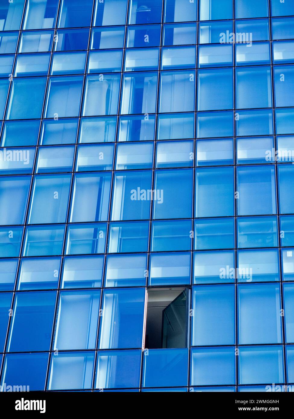 glazed facade of a skyscraper with a single open window Stock Photo - Alamy