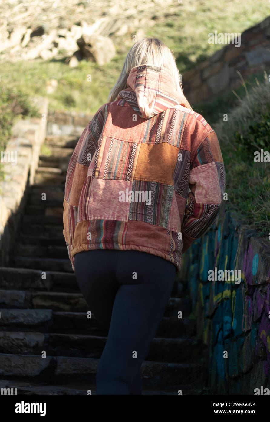 Young blonde climbing ladder in hi-res stock photography and images - Alamy