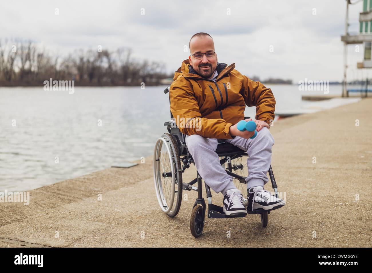 Handicapped man in wheelchair hi-res stock photography and images - Alamy