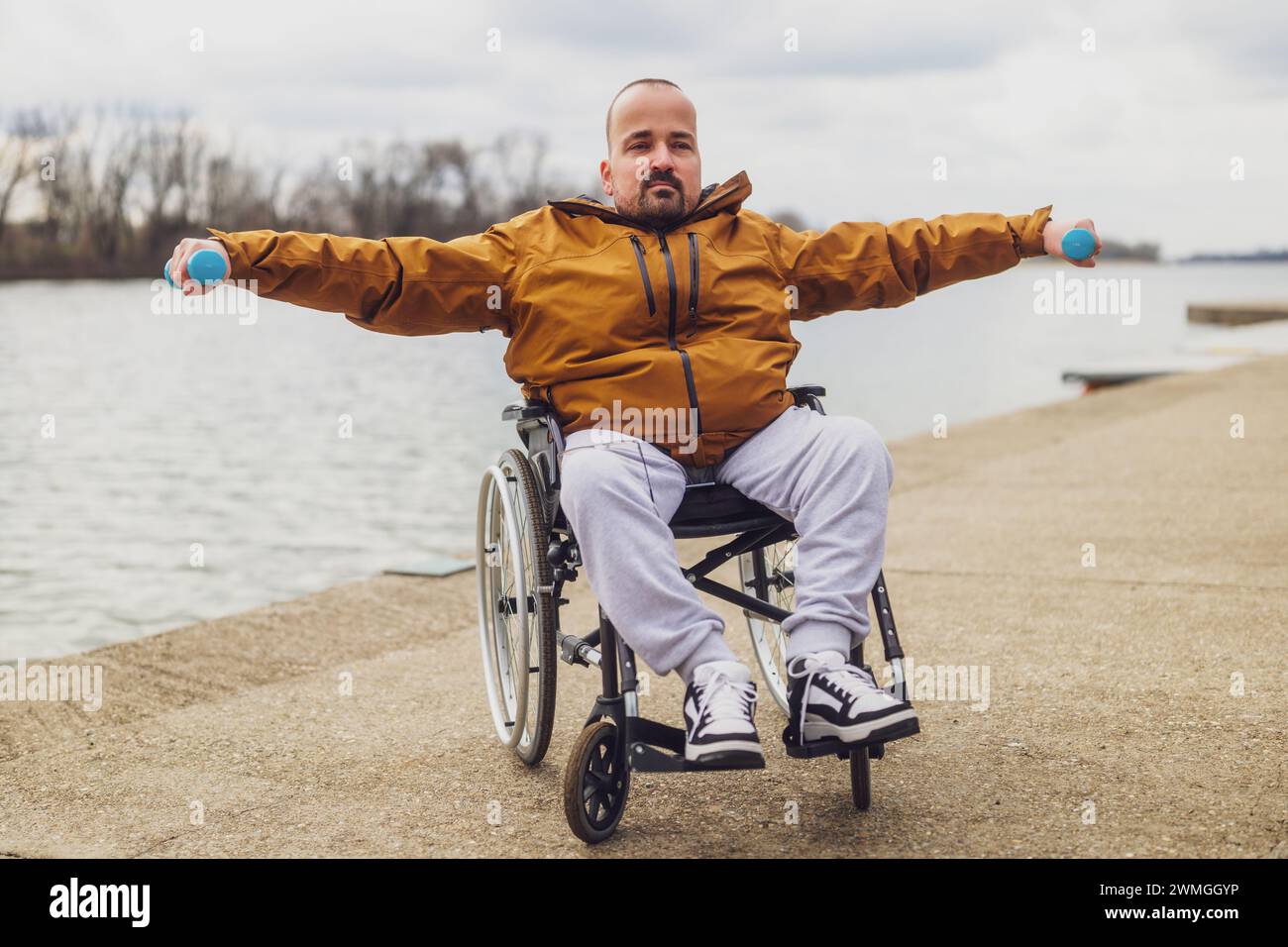 Handicapped man in wheelchair hi-res stock photography and images - Alamy