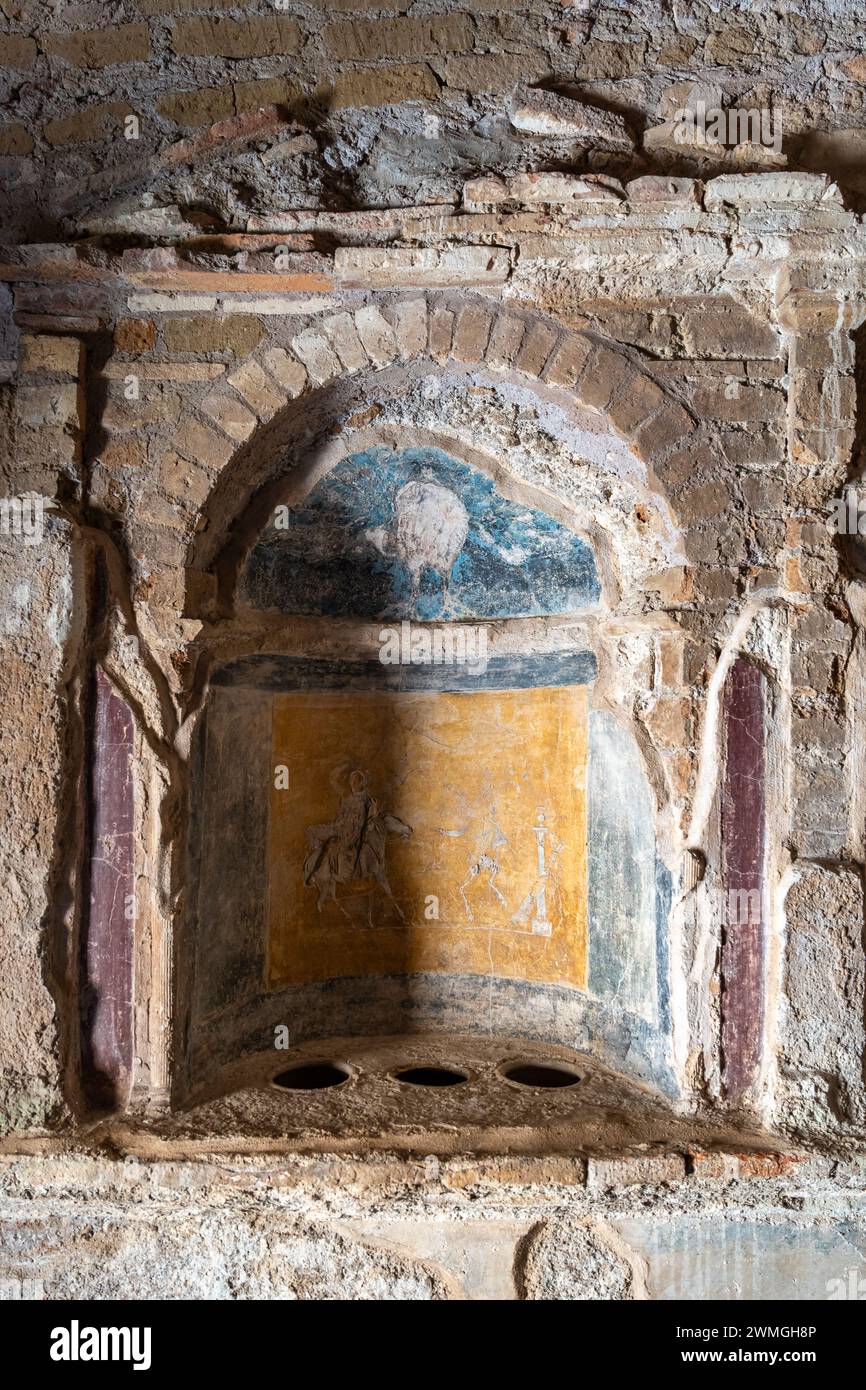 Ruins of colorful fresco decorating the niche of ancient roman funerary ...