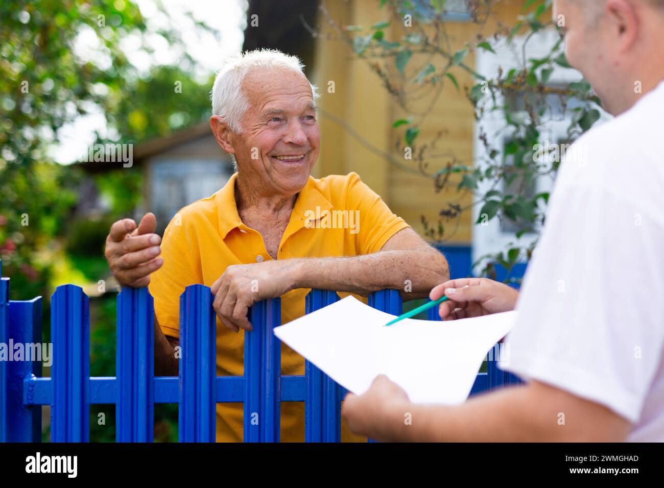 Elderly man having conversation with real estate manager Stock Photo ...