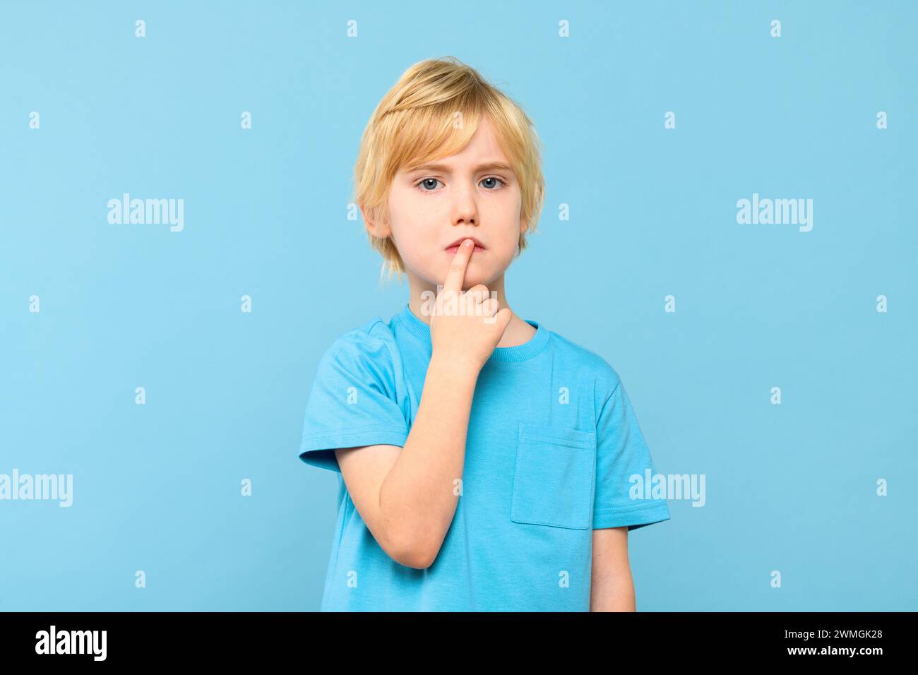 Child solving a problem thinking hi-res stock photography and images ...