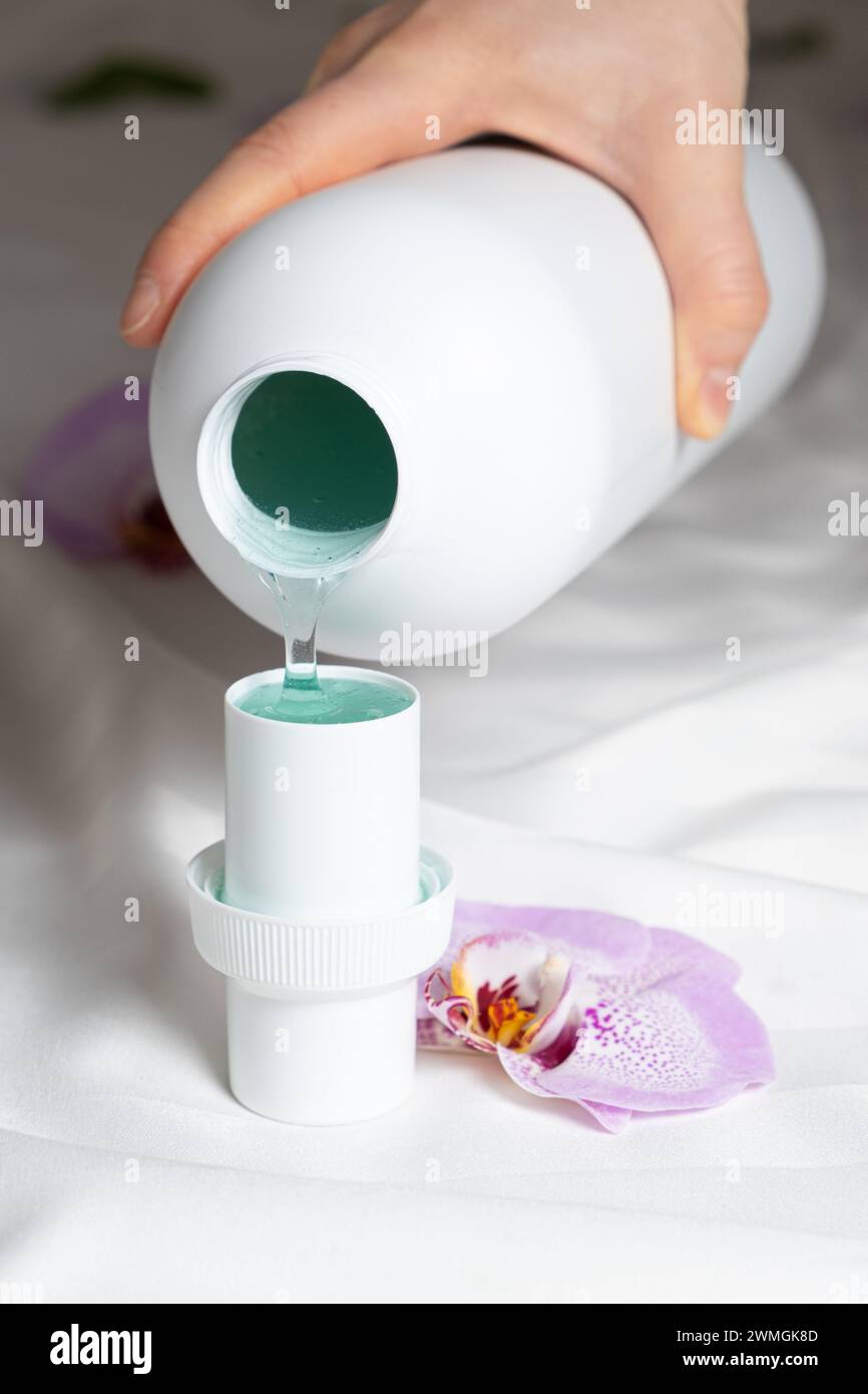 The process of pouring natural eco gel liquid laundry detergent from ...