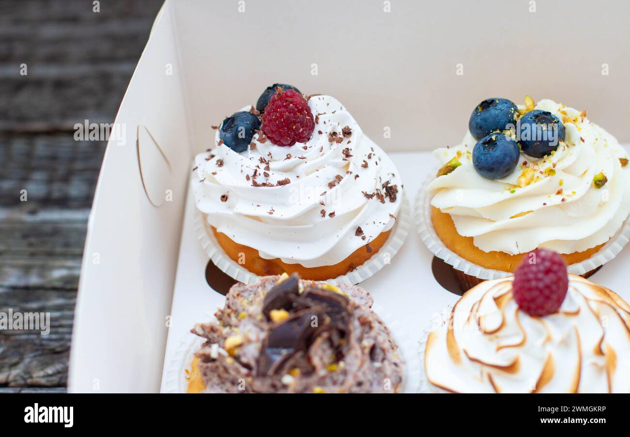 Assorted cupcakes in gift box with chocolate, vanilla and oreo cream ...