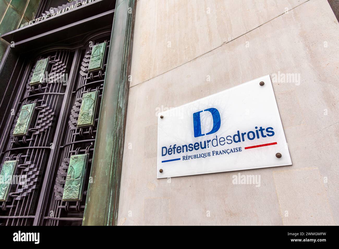 Sign at the entrance to the building of the Défenseur des Droits, a ...