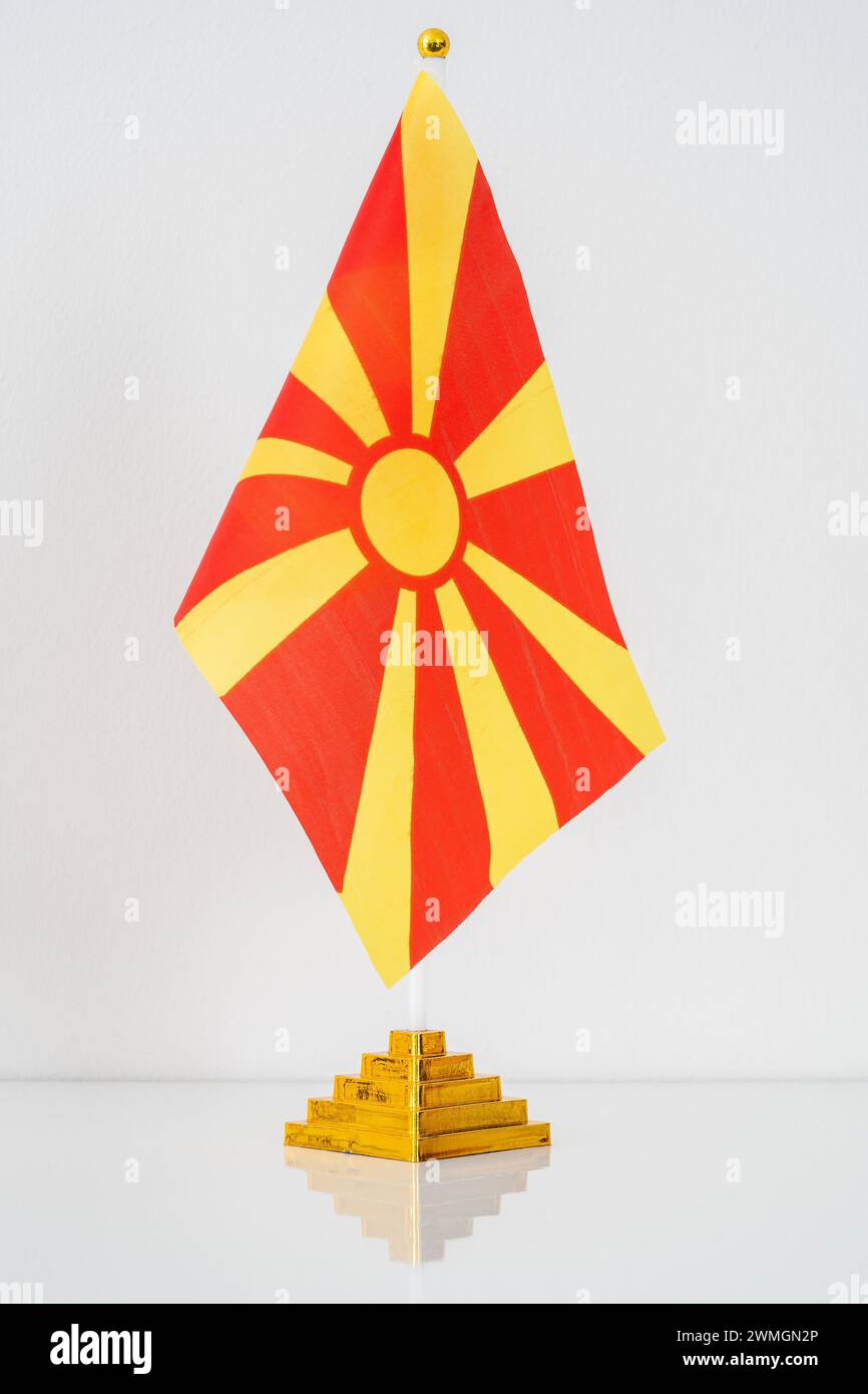 Macedonian flag on a golden stand on a white background Stock Photo - Alamy