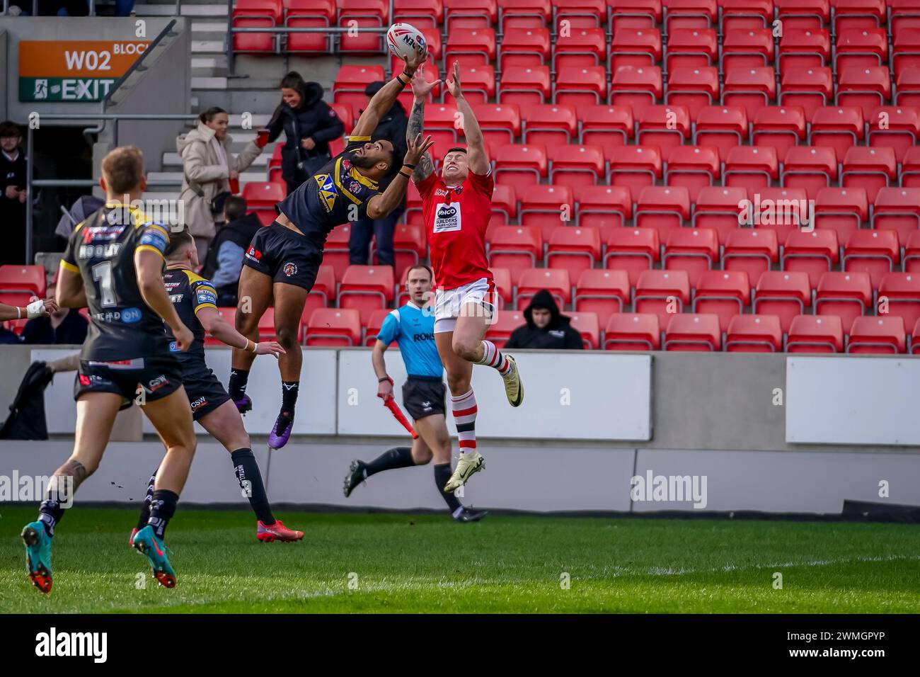 Deon Cross jumping for the ball in a high challenge with a castleford player. Salford Red Devils ...