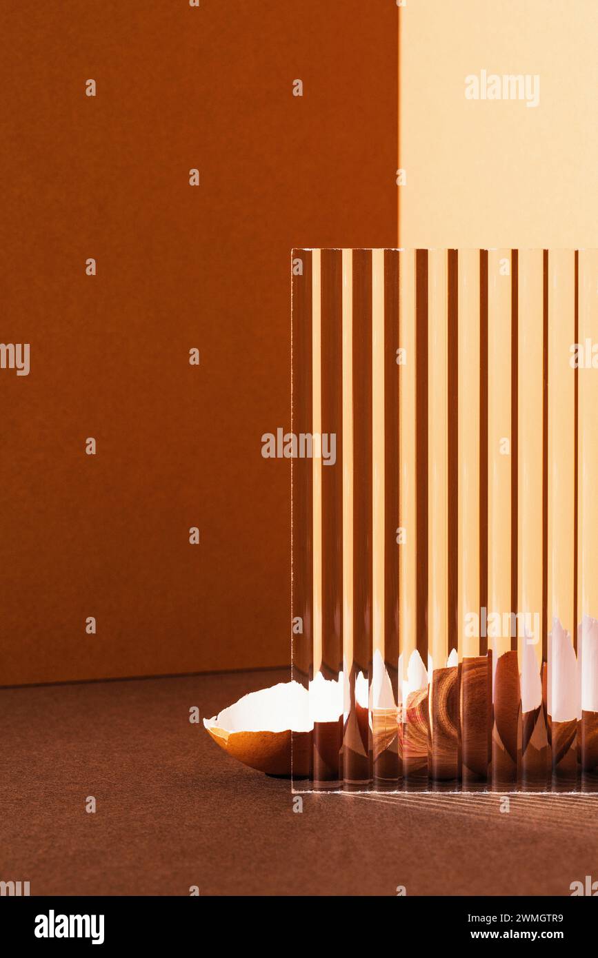 Egg shells seen behind a corrugated glass, refraction and shadow on ...