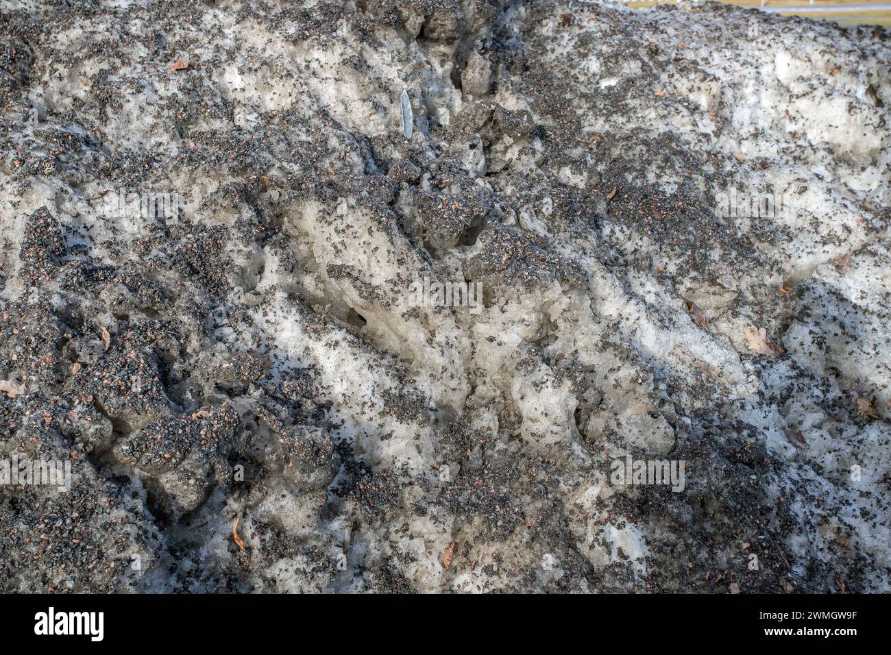 Dirty snow with gravel waiting to be shoveled away Stock Photo - Alamy