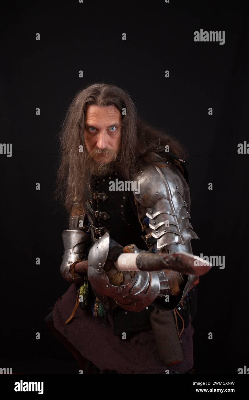 Vertical composition. Medieval knight in shining armor with spear on ...