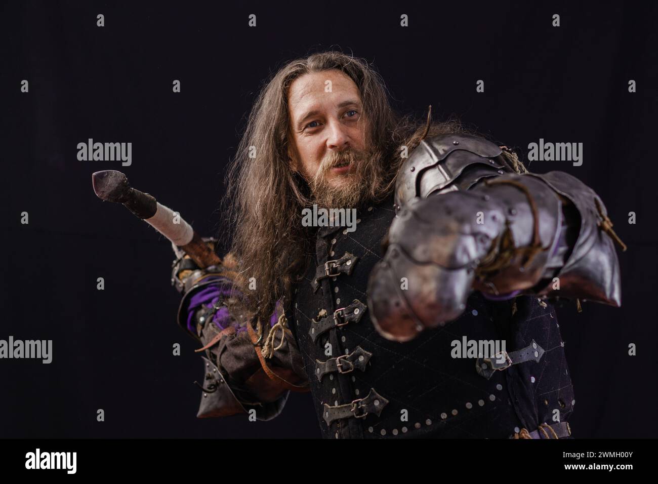 A brave medieval knight with a distinctive appearance swings for ...