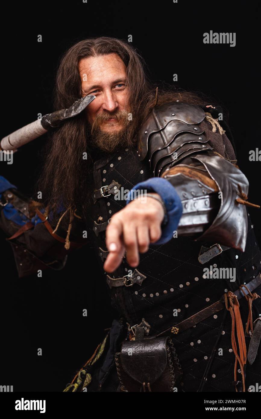 The concentrated gaze and tense posture of a medieval knight preparing ...