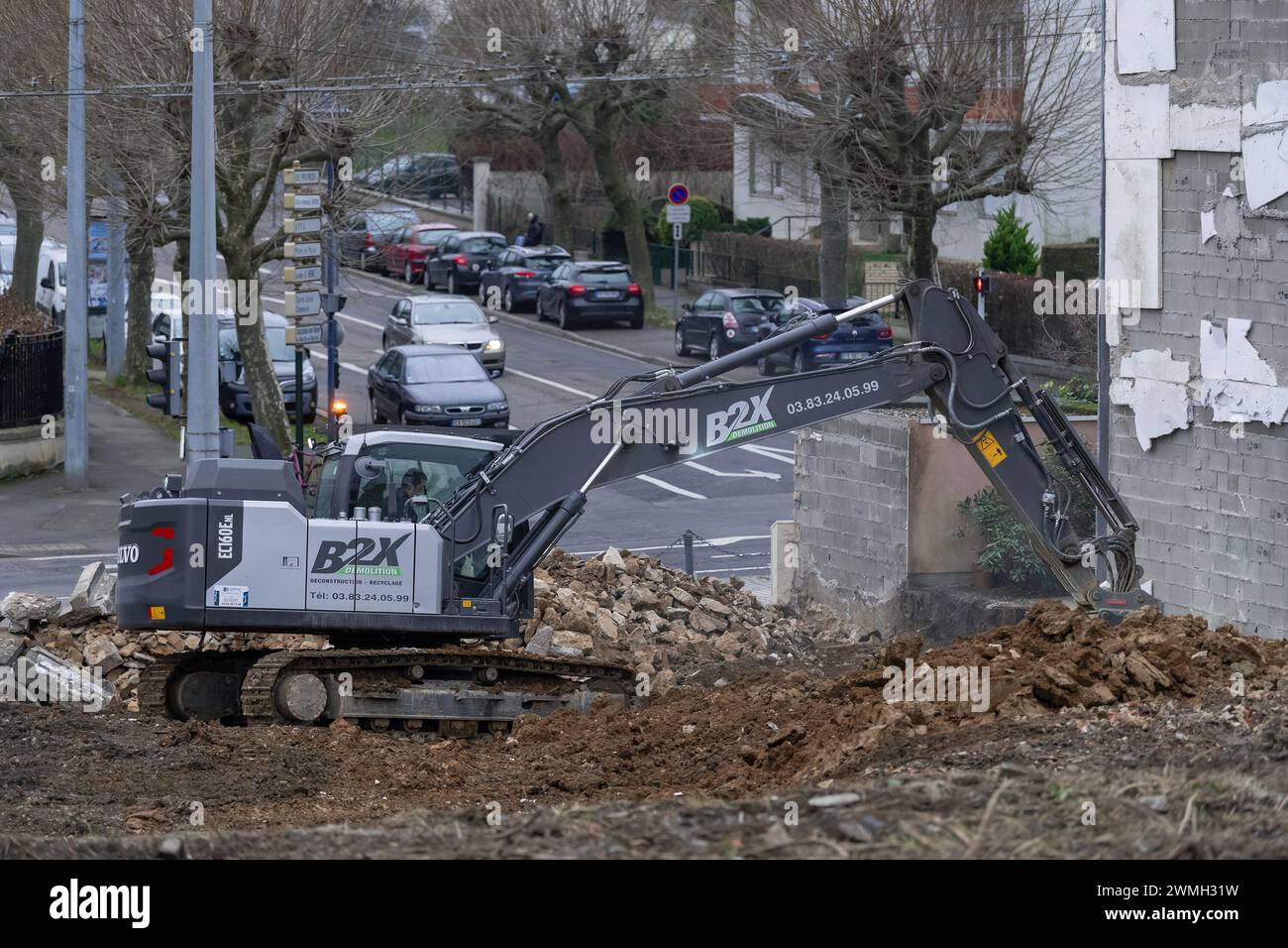 Laxou, France - Grey crawler excavator Volvo EC160ENL demolishing a ...