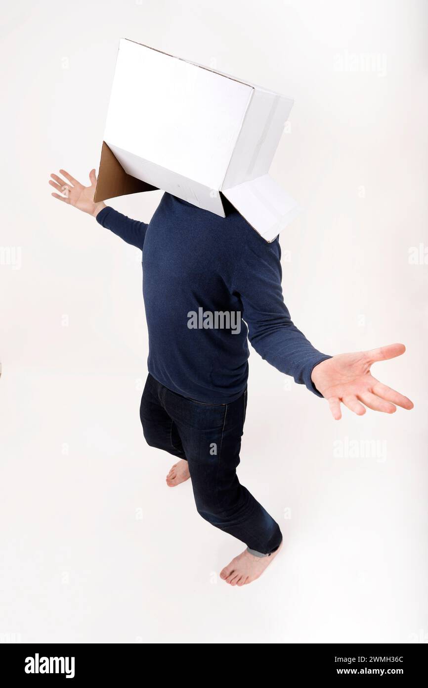 man with a cardboard box on his head.STUDIO SHOOT Stock Photo - Alamy