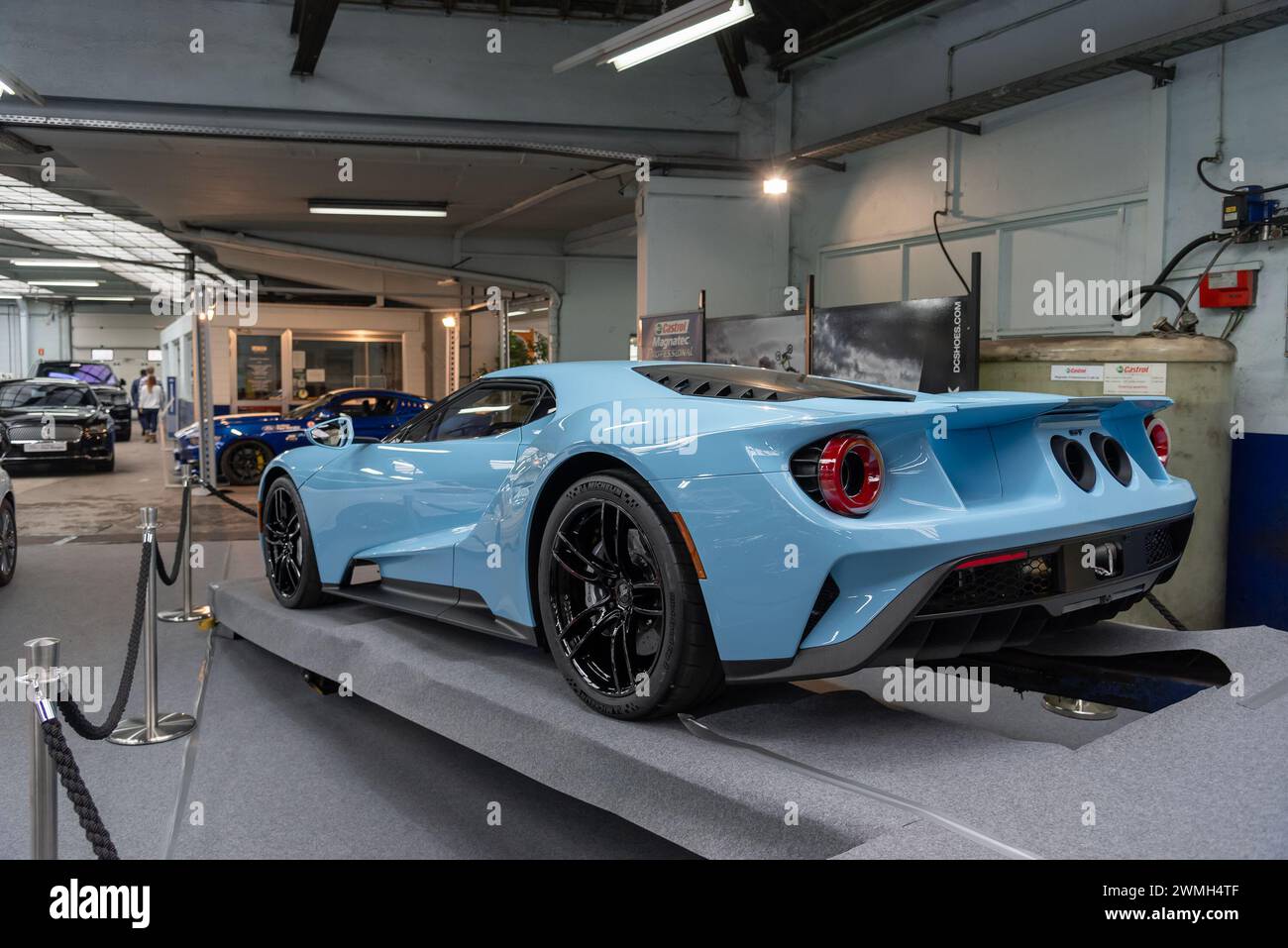 Luxembourg City, Luxembourg - Focus on a blue Ford GT in a showroom ...