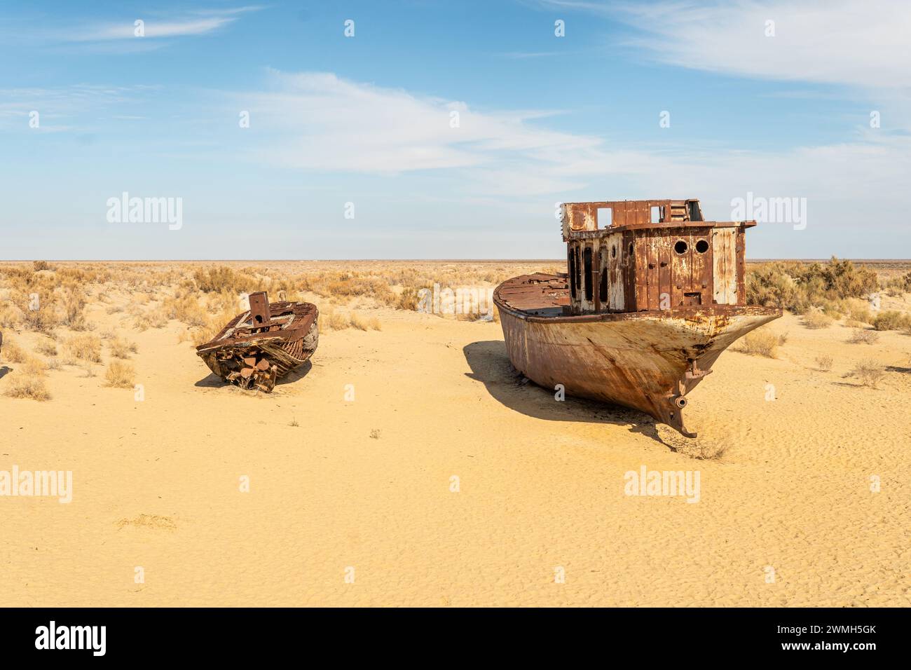 Rusty abandoned ships at the Ship cemetery at the former Aral sea coast ...