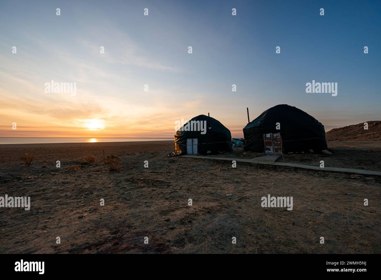 Yurt camp in the mid of desert against the background of a beautiful ...