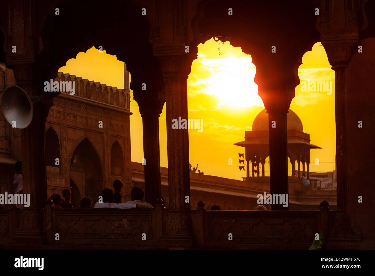 intensive beautiful sunset seem at the arcades of the red Fort in New ...