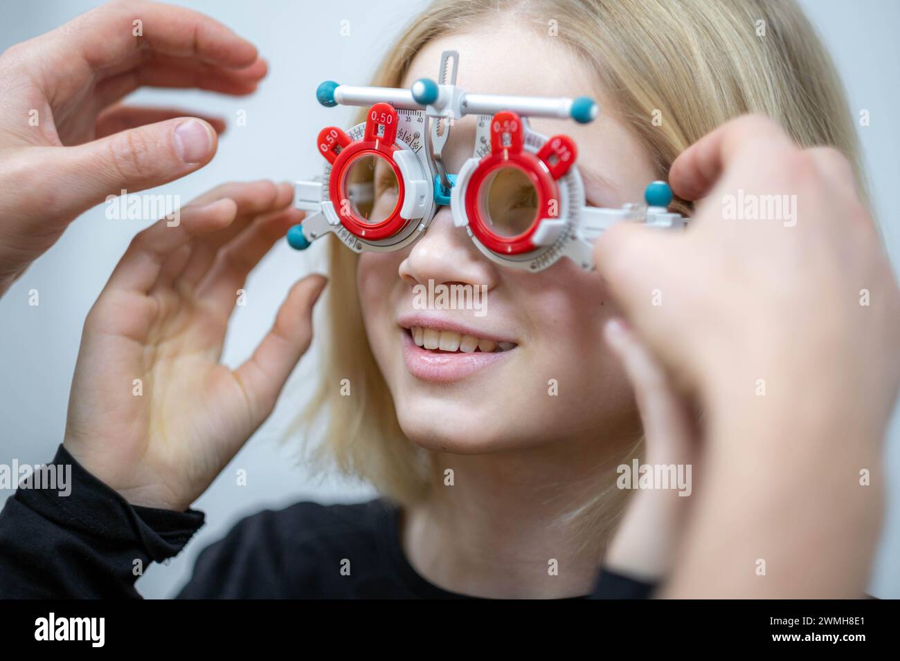 portrait happy little girl patient ophthalmology clinic, vision test in ...