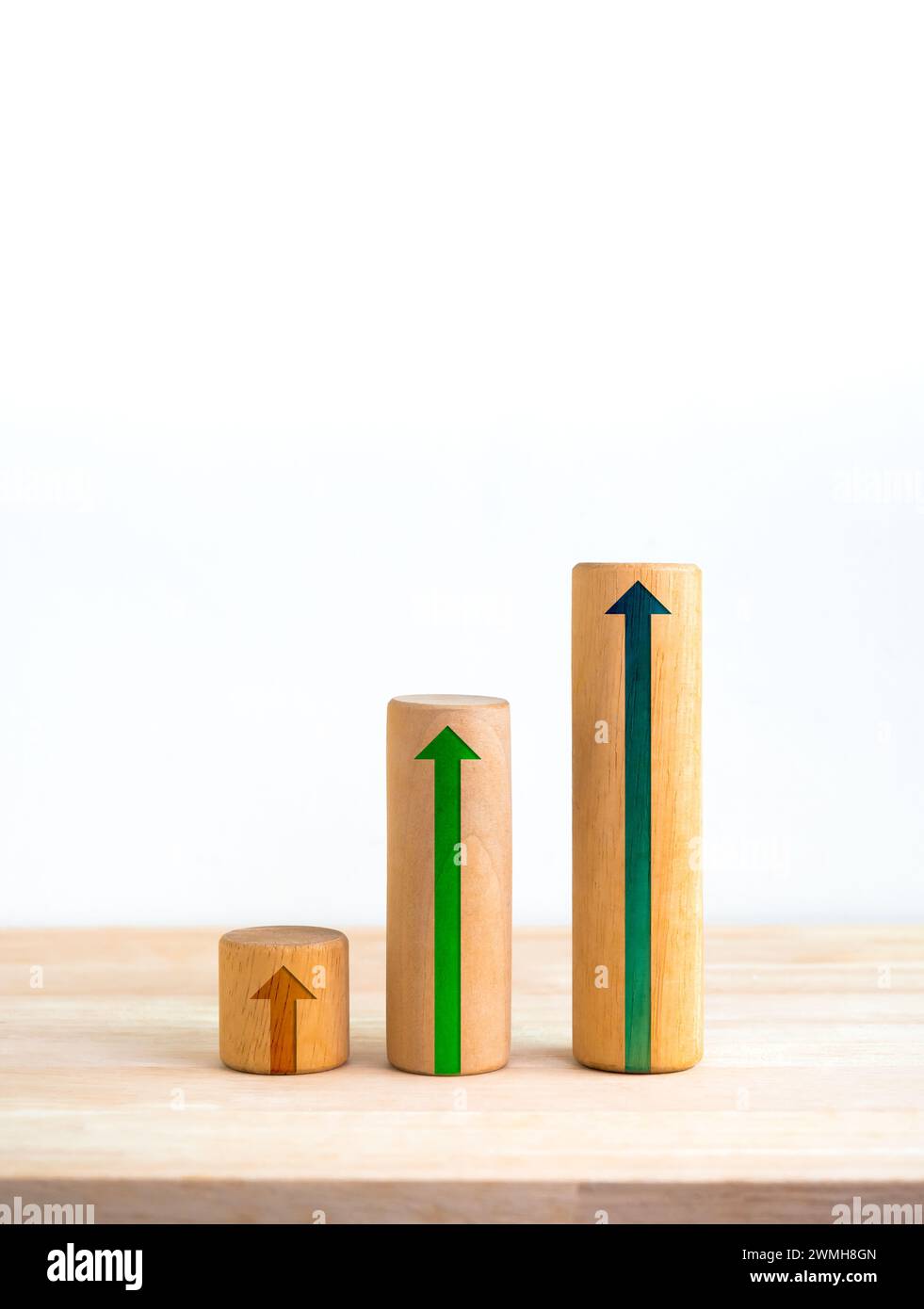 Rising up arrows on round wooden sticks as business graph steps ...