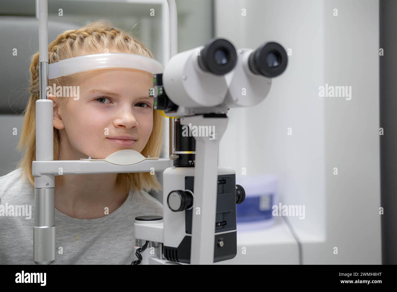 portrait happy little girl patient ophthalmology clinic, vision test in ...
