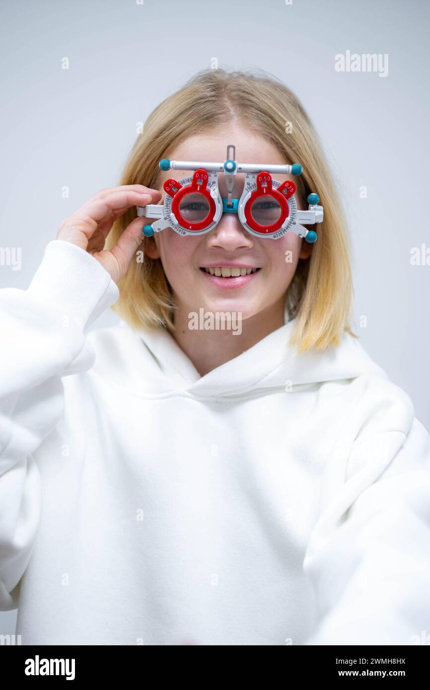 portrait happy little girl patient ophthalmology clinic, vision test in ...
