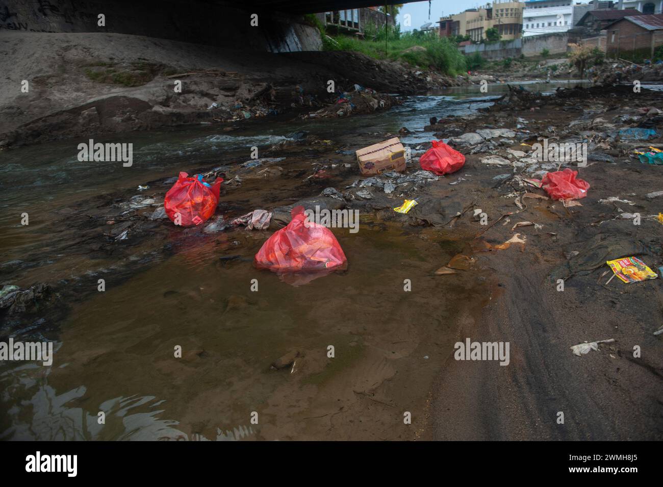 The Deli River streamline which is polluted by plastic waste in Medan ...