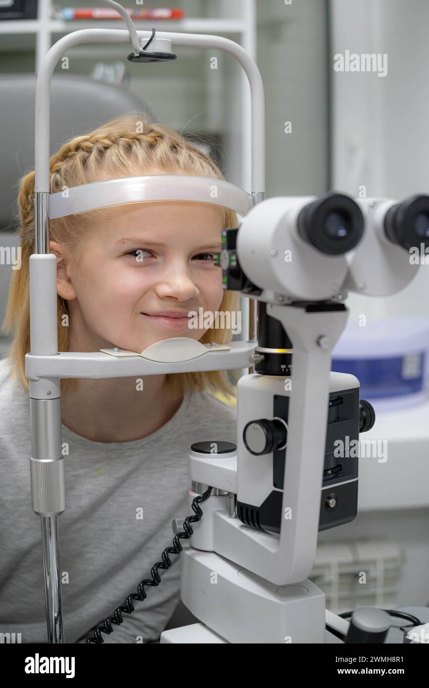 portrait happy little girl patient ophthalmology clinic, vision test in ...