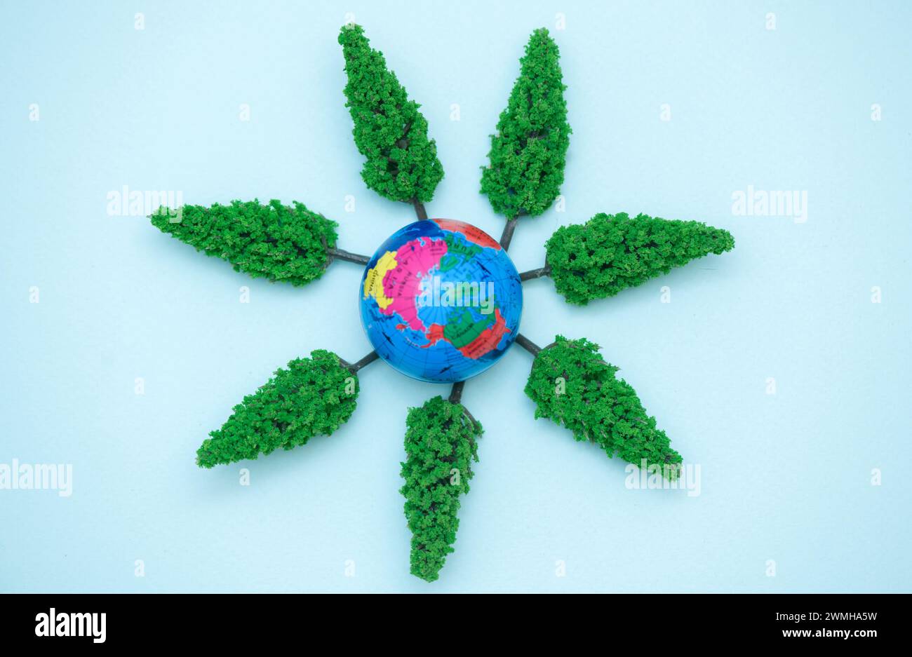 World environment day concept. Layout of planet Earth with green plants ...