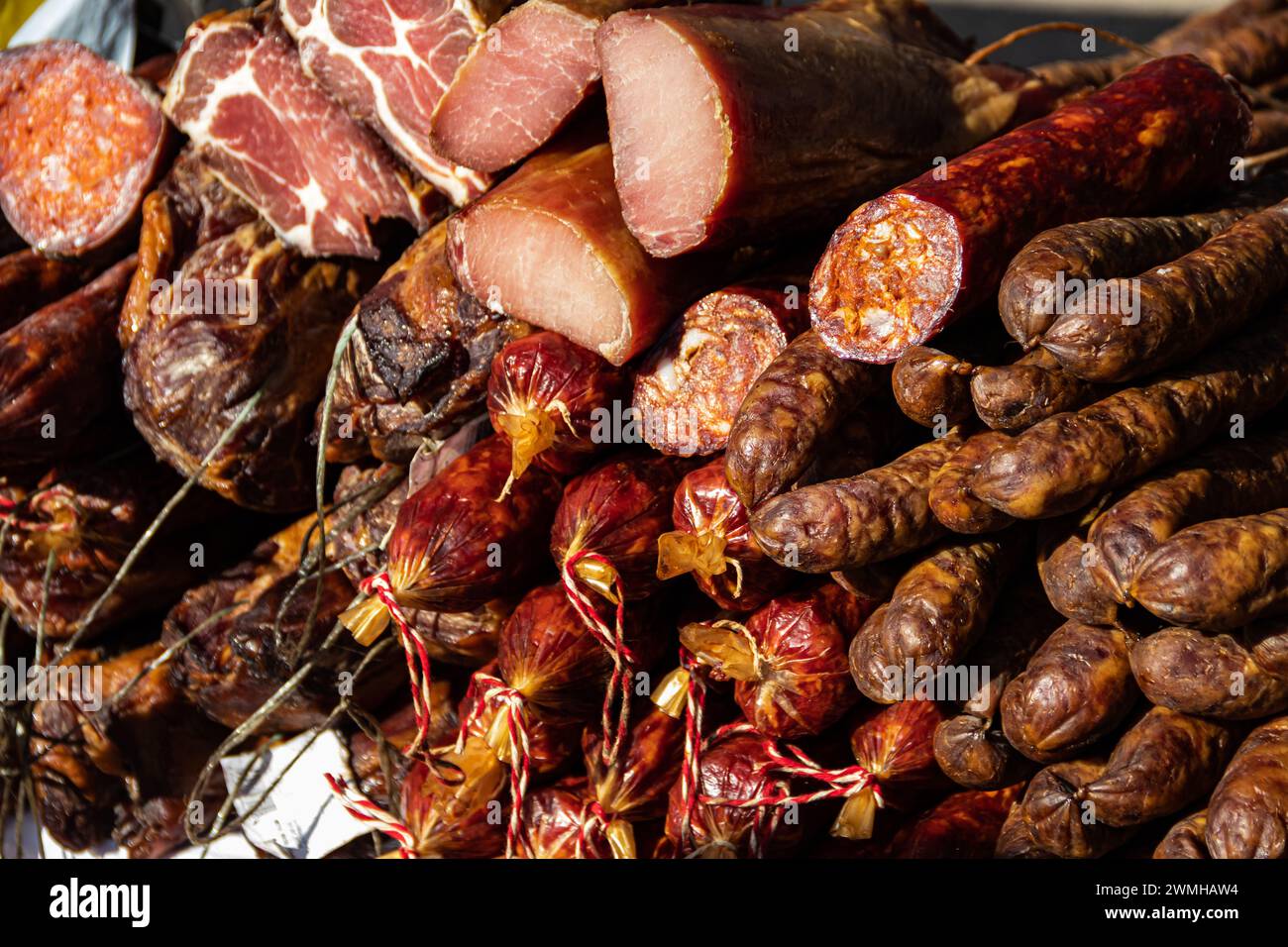 Serbian traditionally made and smoke dried sausages on a farmer's ...