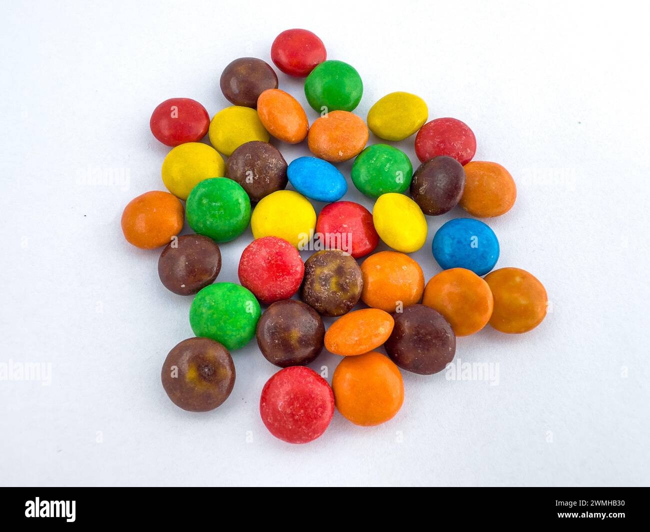 Colorful button candies on white isolated background Stock Photo - Alamy