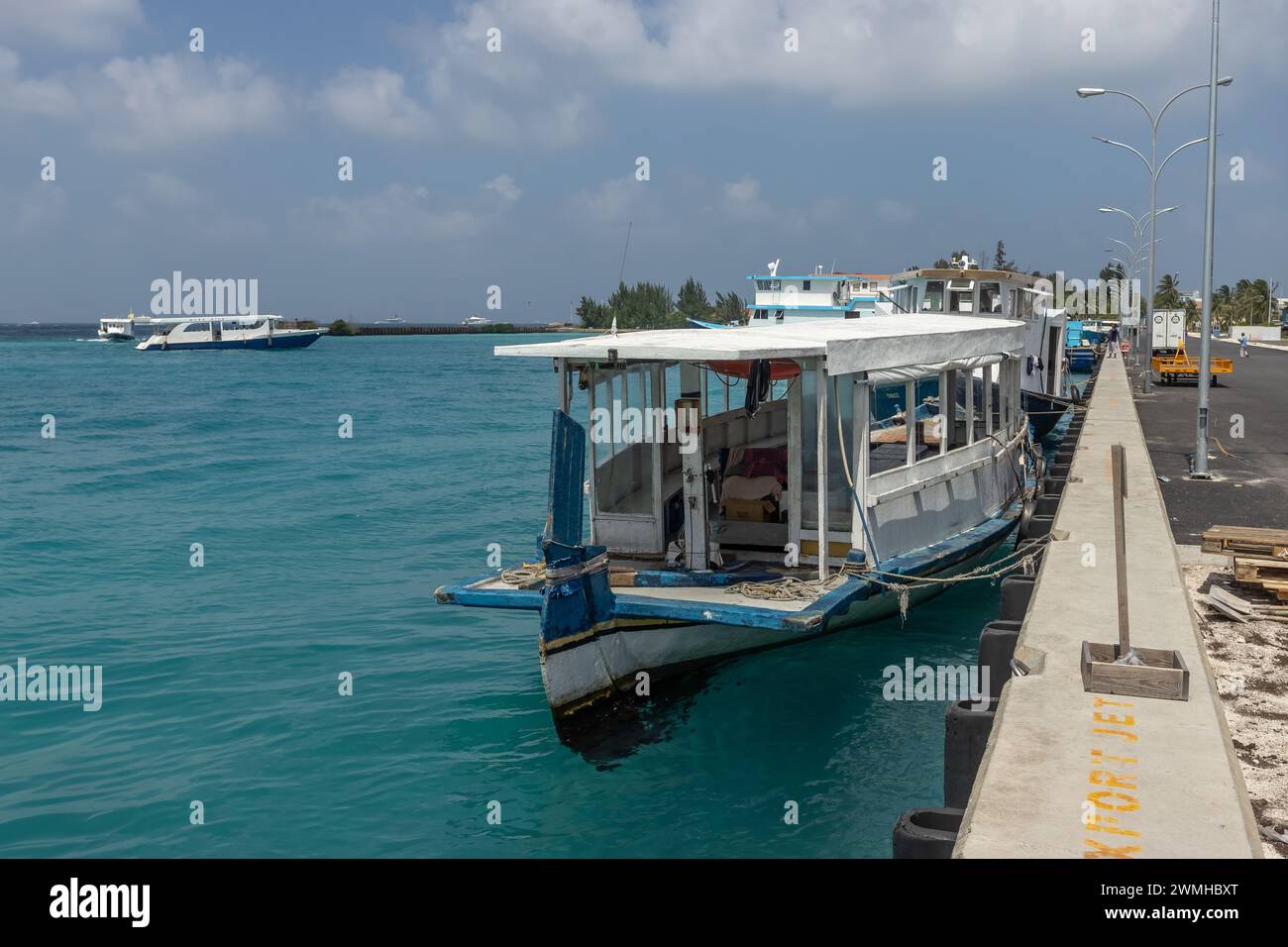 A local wooden ferry moored in ferry terminal by Male airport (Maldives ...