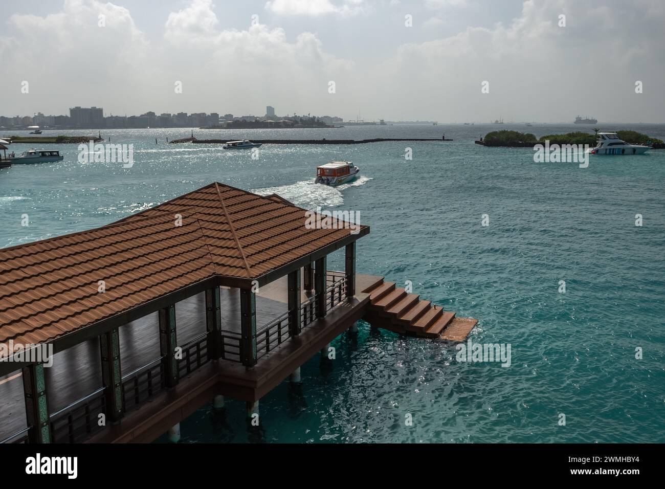 A view of the ferry terminal by Male Airport (Maldives) from above on a ...