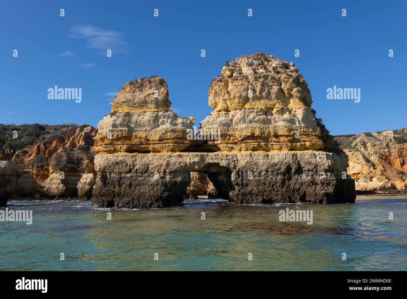 Algarve coast with Kissing Couple rock at Ponta da Piedade from ocean ...