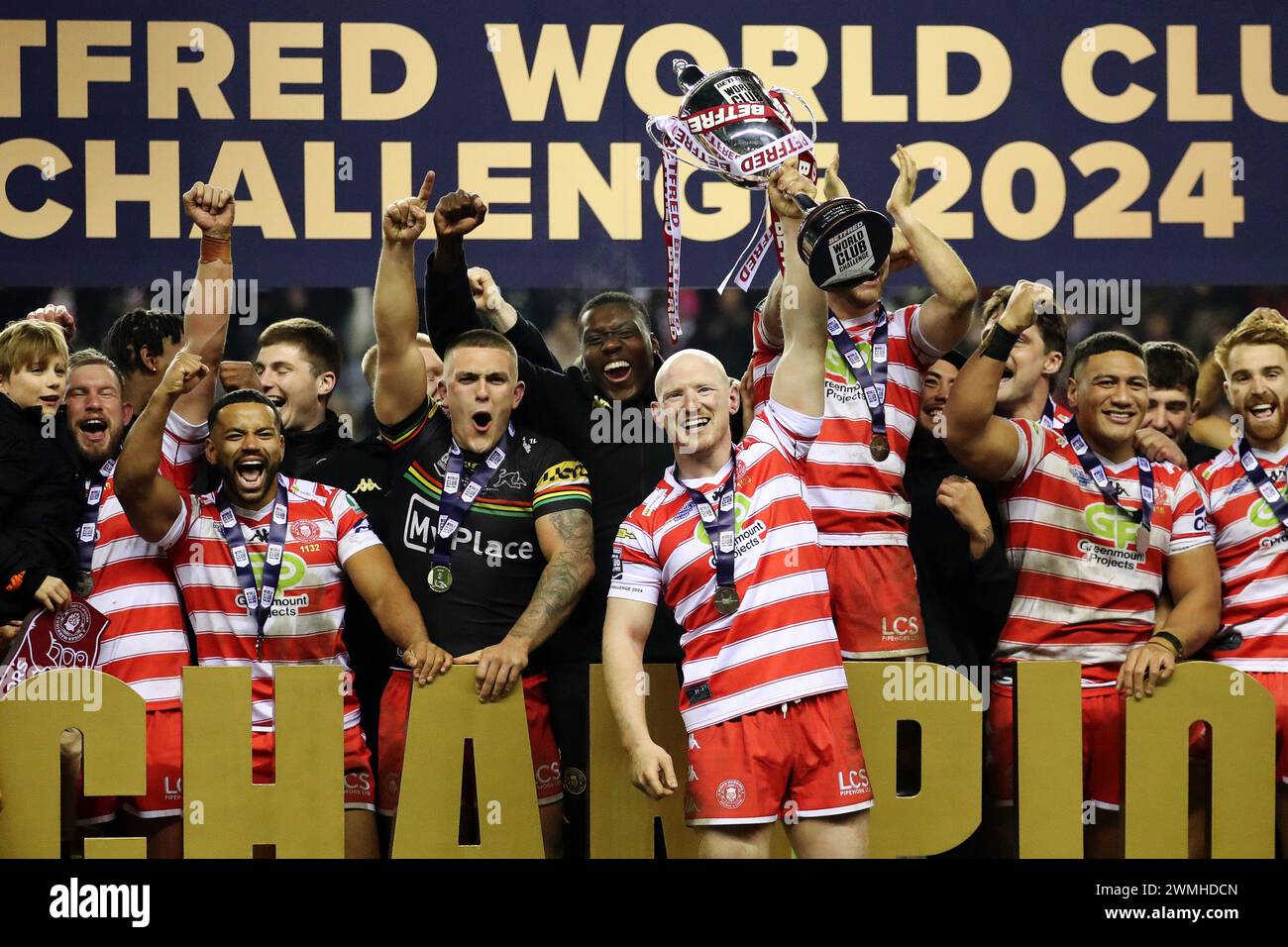 Wigan Warriors' Liam Farrell lifts the World Club Challenge trophy ...