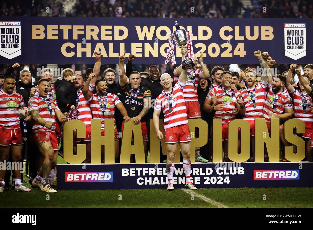 Wigan Warriors' Liam Farrell lifts the World Club Challenge trophy ...