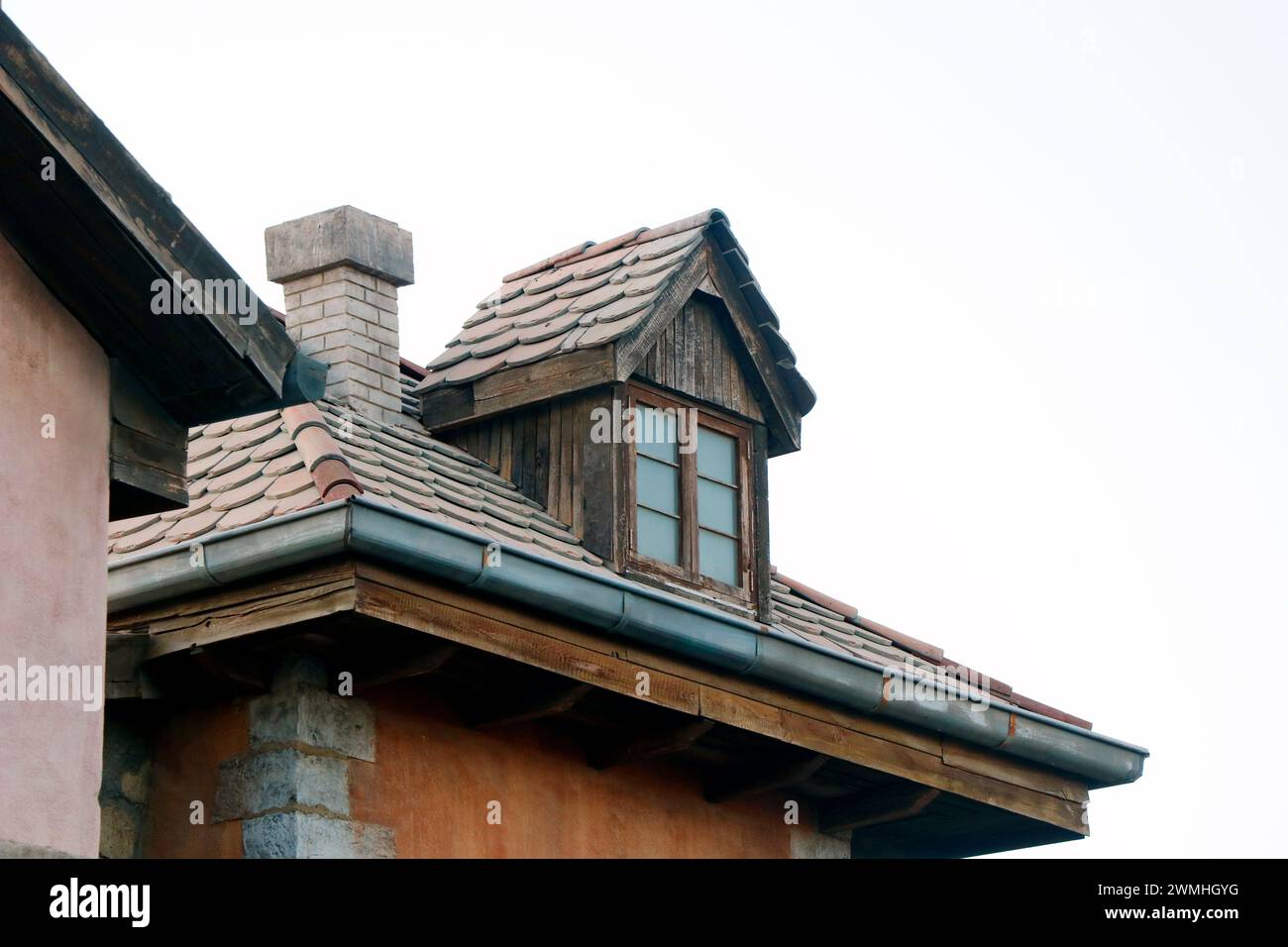 classic european roof and brick work with chimney Stock Photo - Alamy