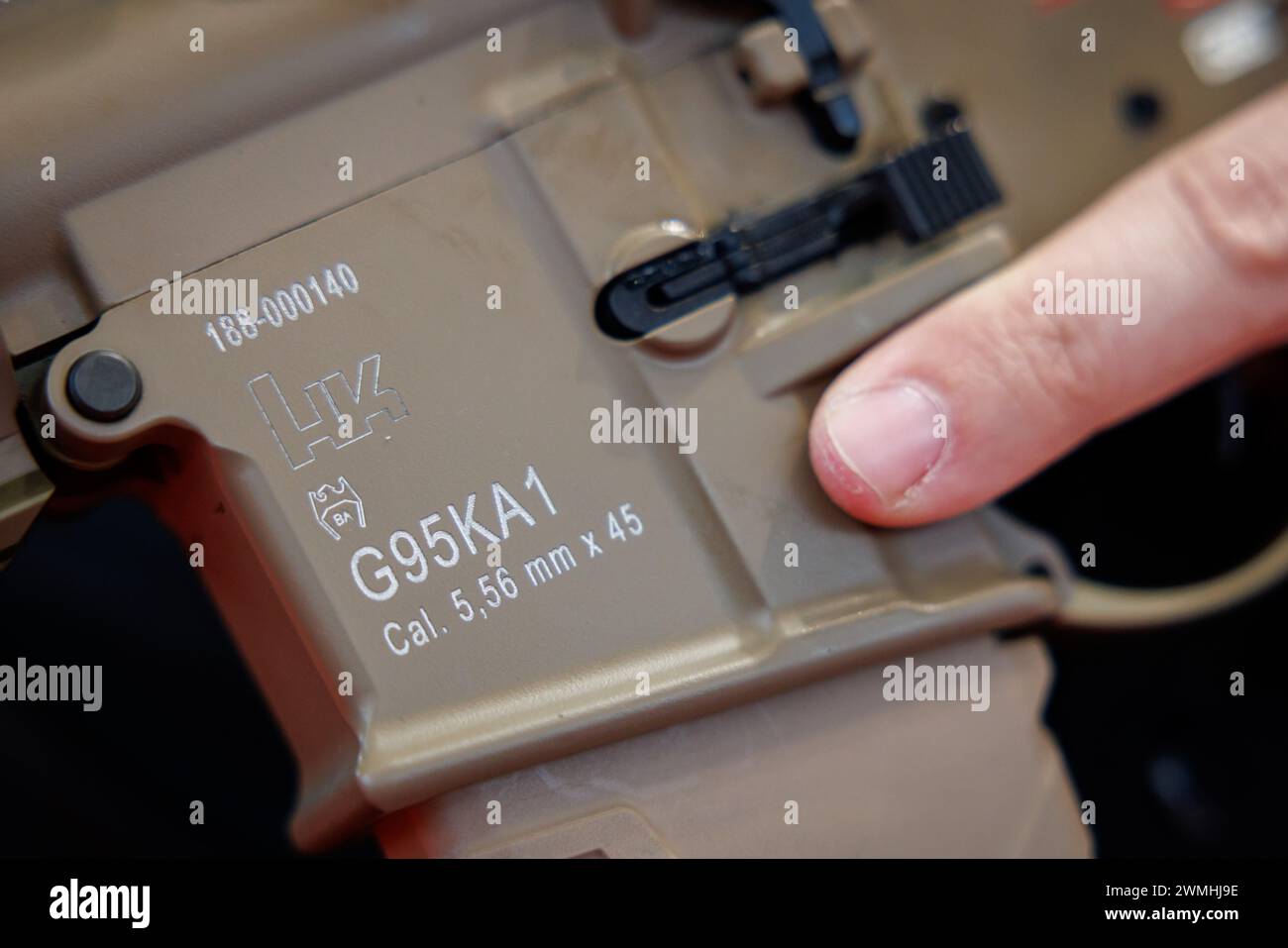 Nuremberg, Germany. 26th Feb, 2024. A man holds the G95 KA1 assault ...