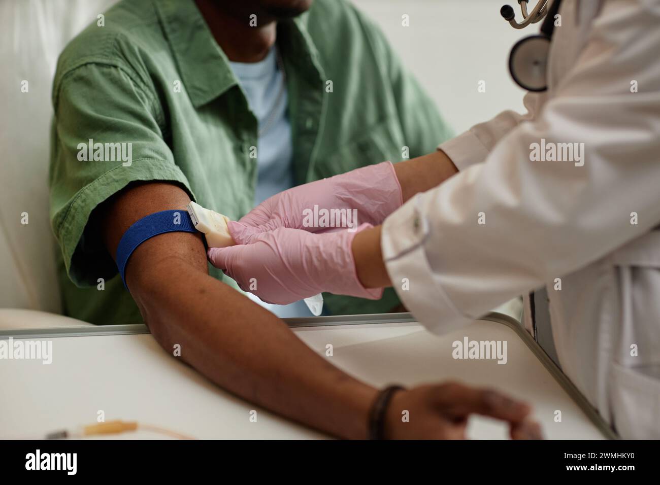 African man putting arm hi-res stock photography and images - Alamy