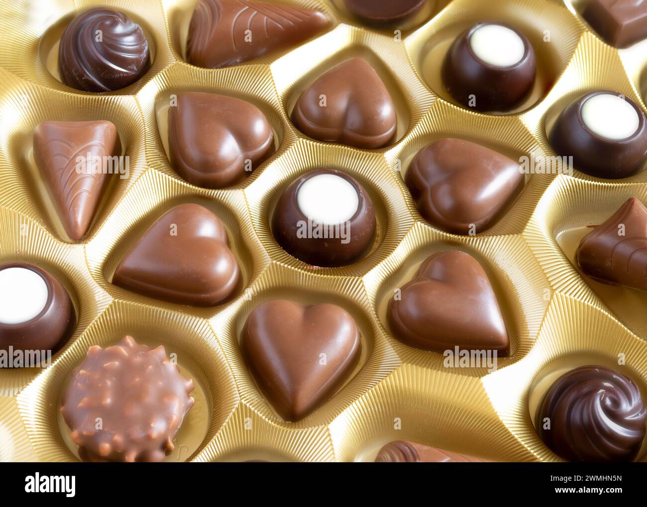 Heart shaped milk chocolates and other Stock Photo - Alamy