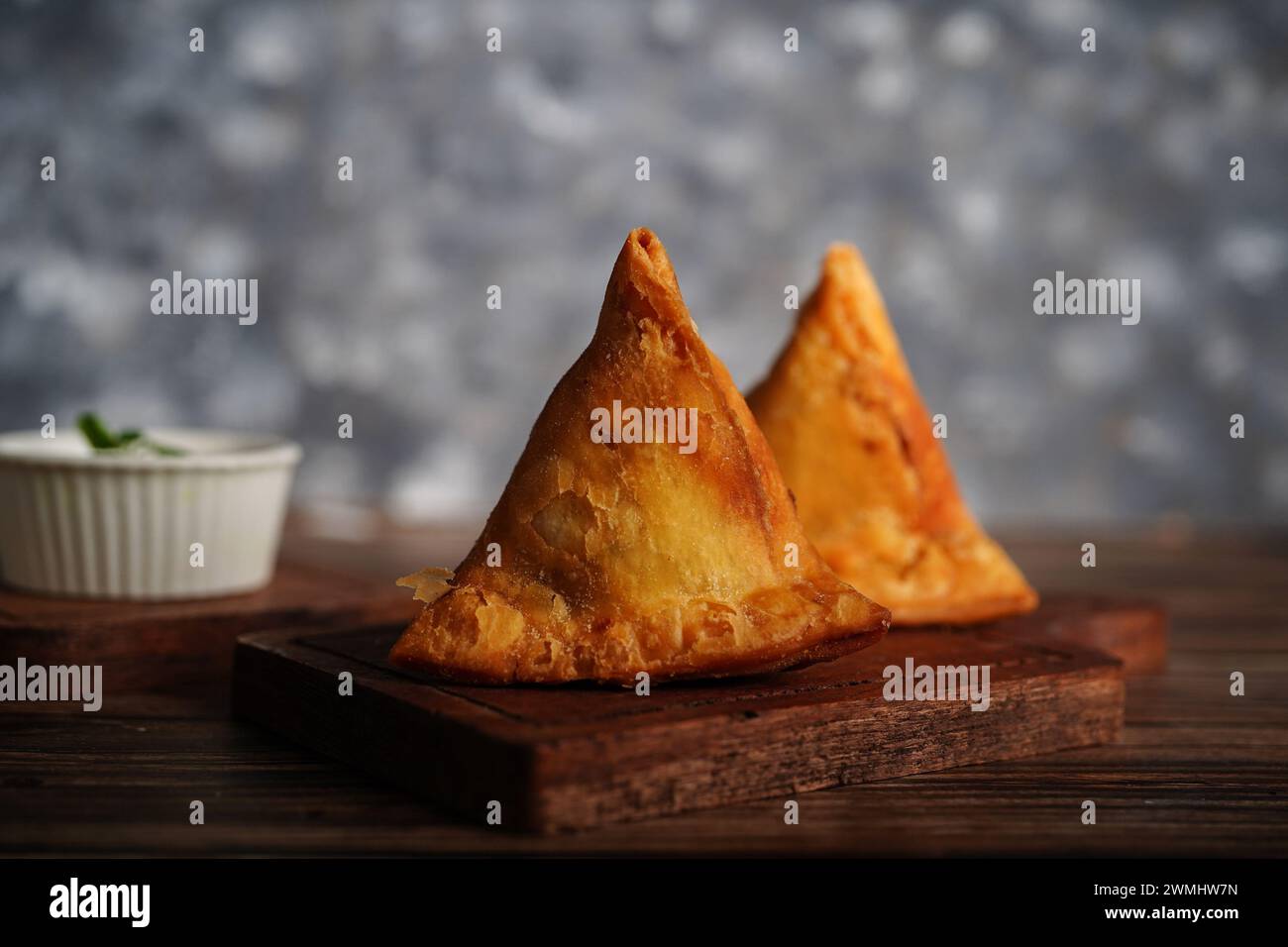 Samosa served with tomato sauce- Indian vegetarian appetizer, selective ...
