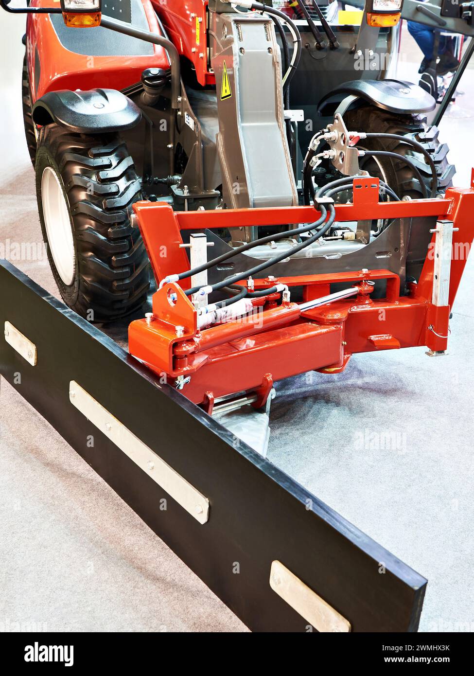 Hydraulically activated feed slide plate on compact telehandler Stock ...