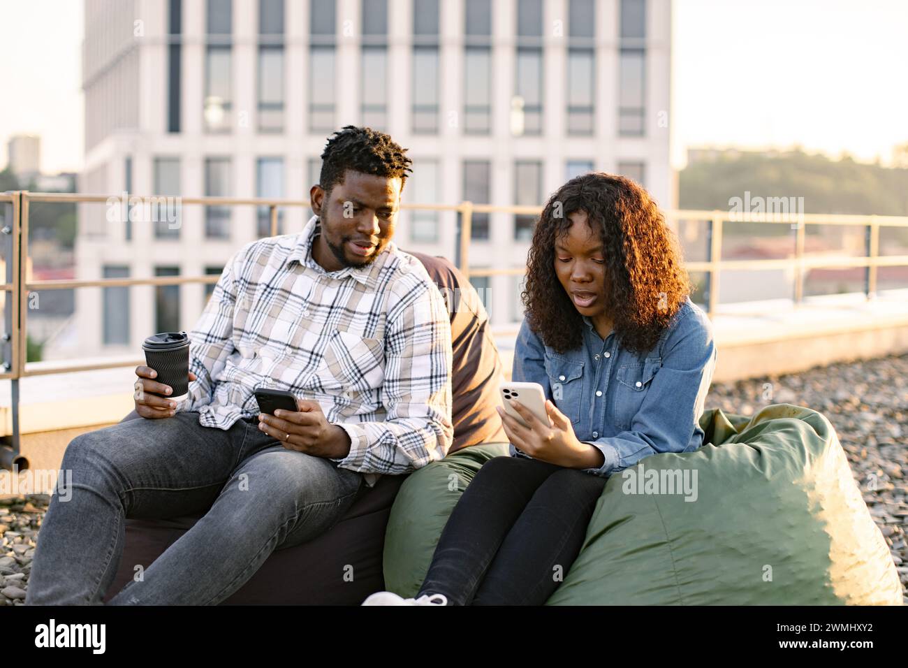 Business people on coffee break using phones outdoor Stock Photo - Alamy