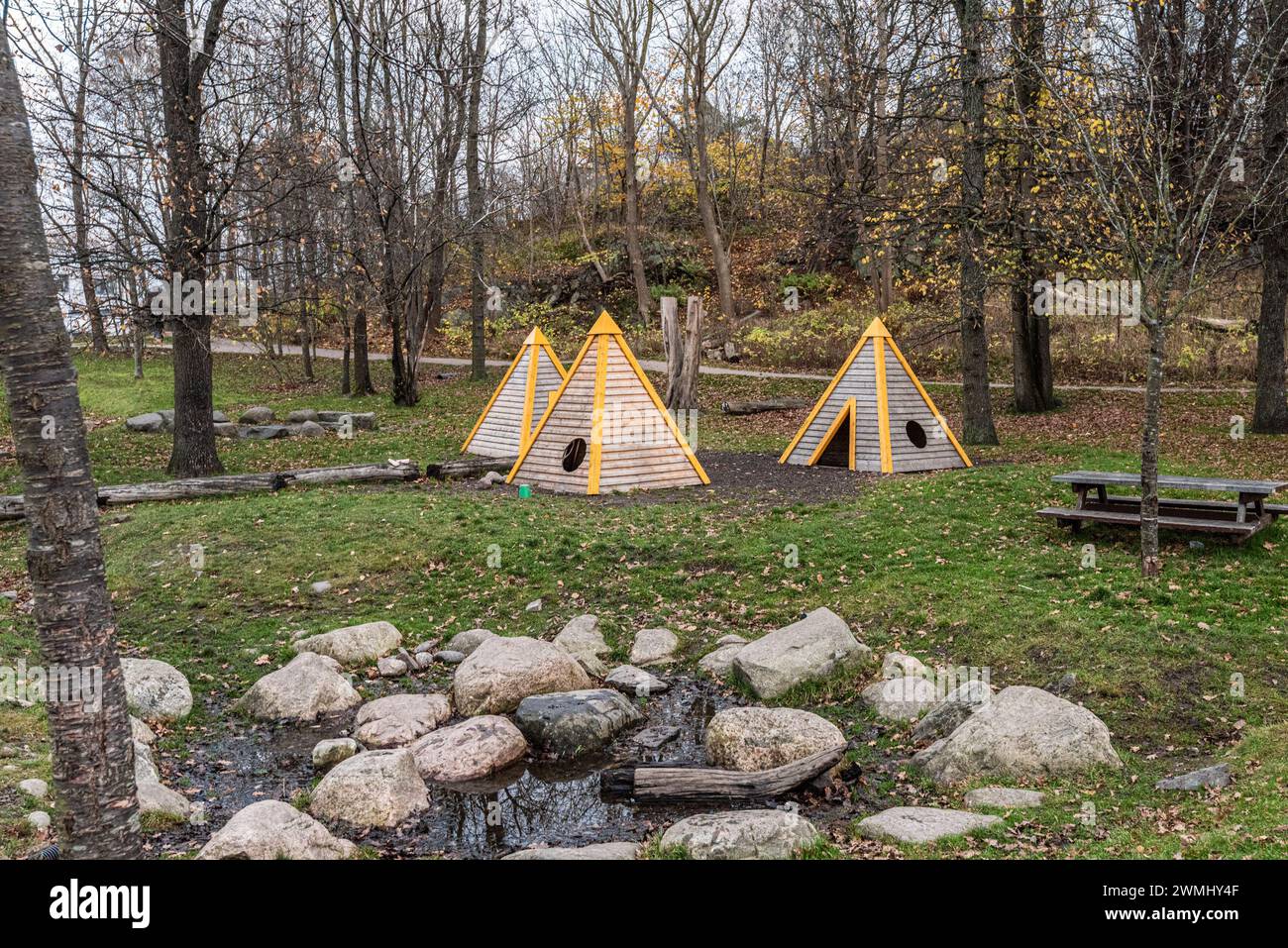 Small wooden huts for playing resembling tipi tents Stock Photo - Alamy