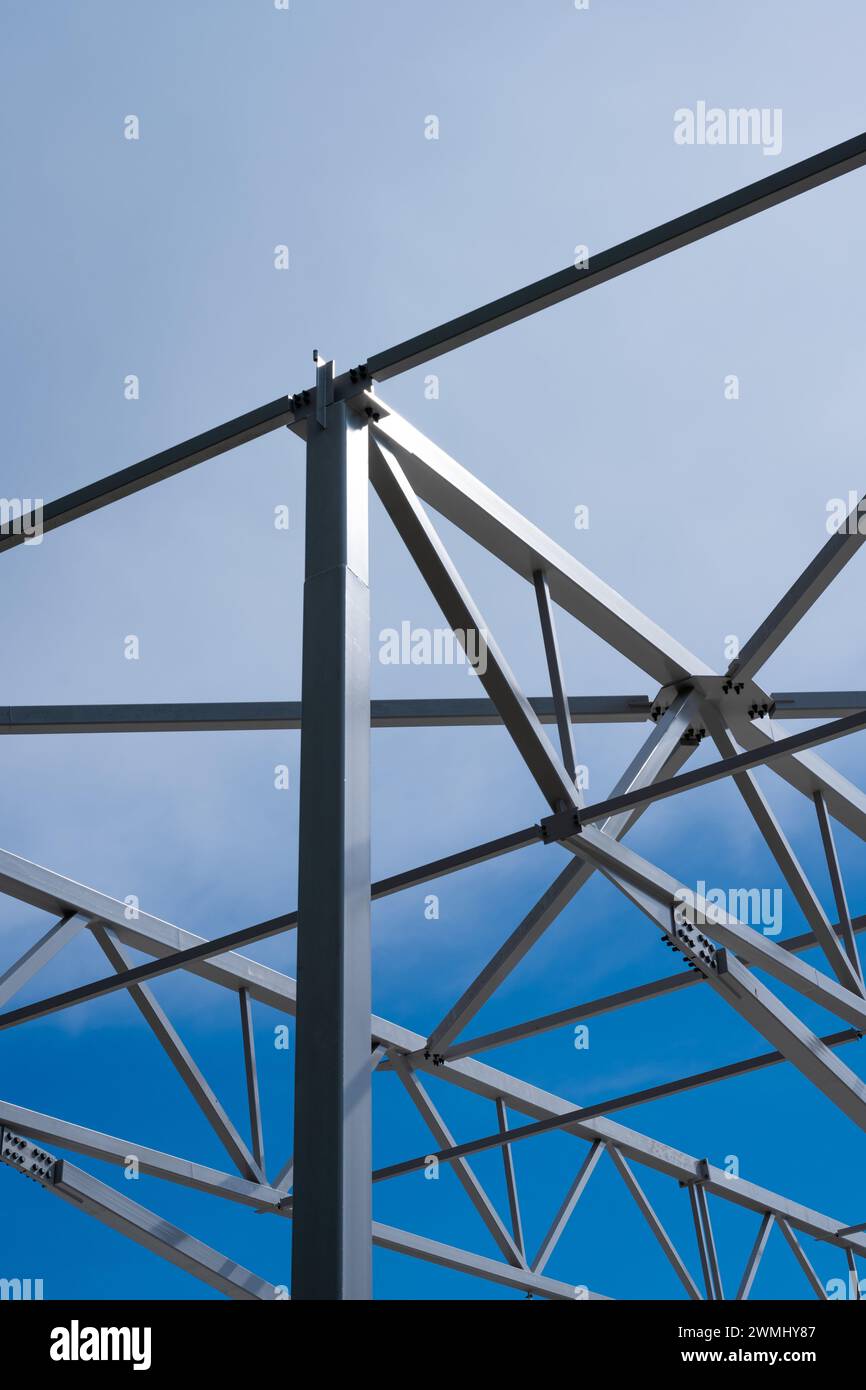 White painted steel beams and girders of a warehouse under construction ...
